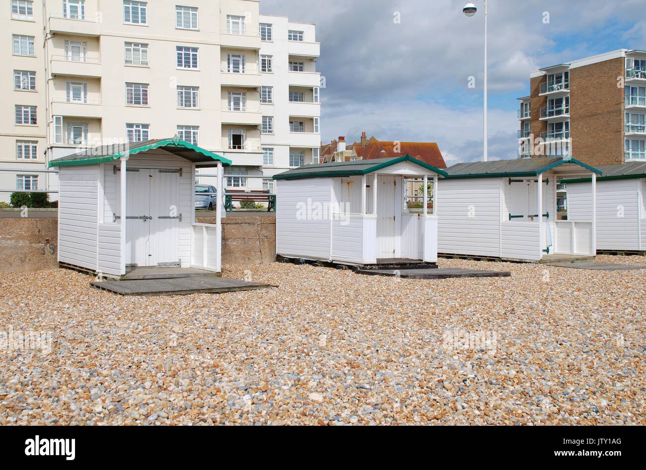 Traditional British beach huts on the beach at Bexhill-on-Sea in East ...