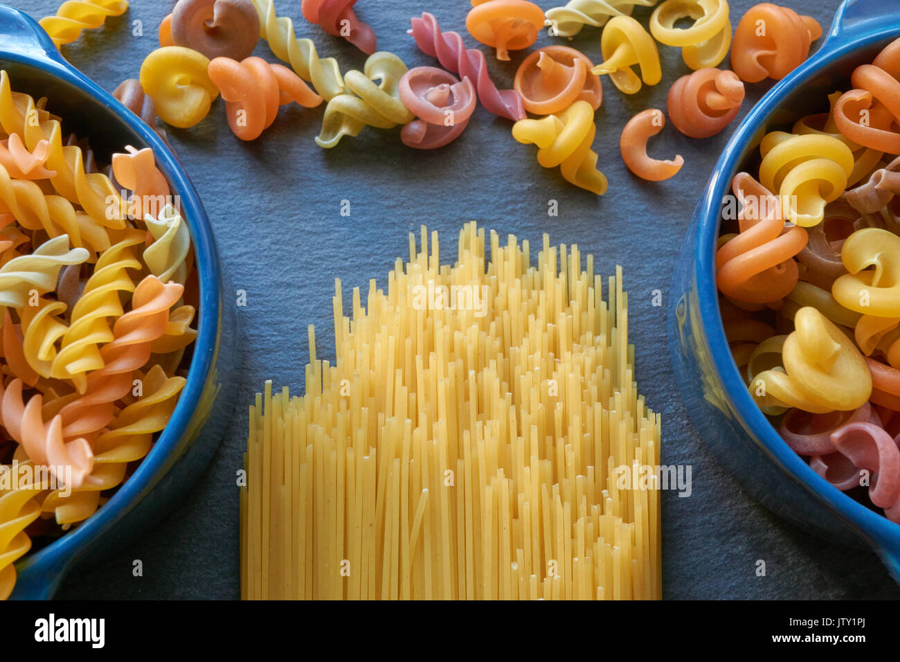 italian pasta in different shapes. straight, spiral, sea shells on ...