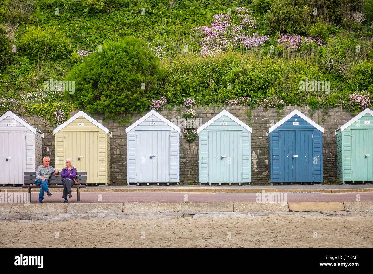 Bournemouth, England - May 29, 2017 : Older couple sitting on the bench ...