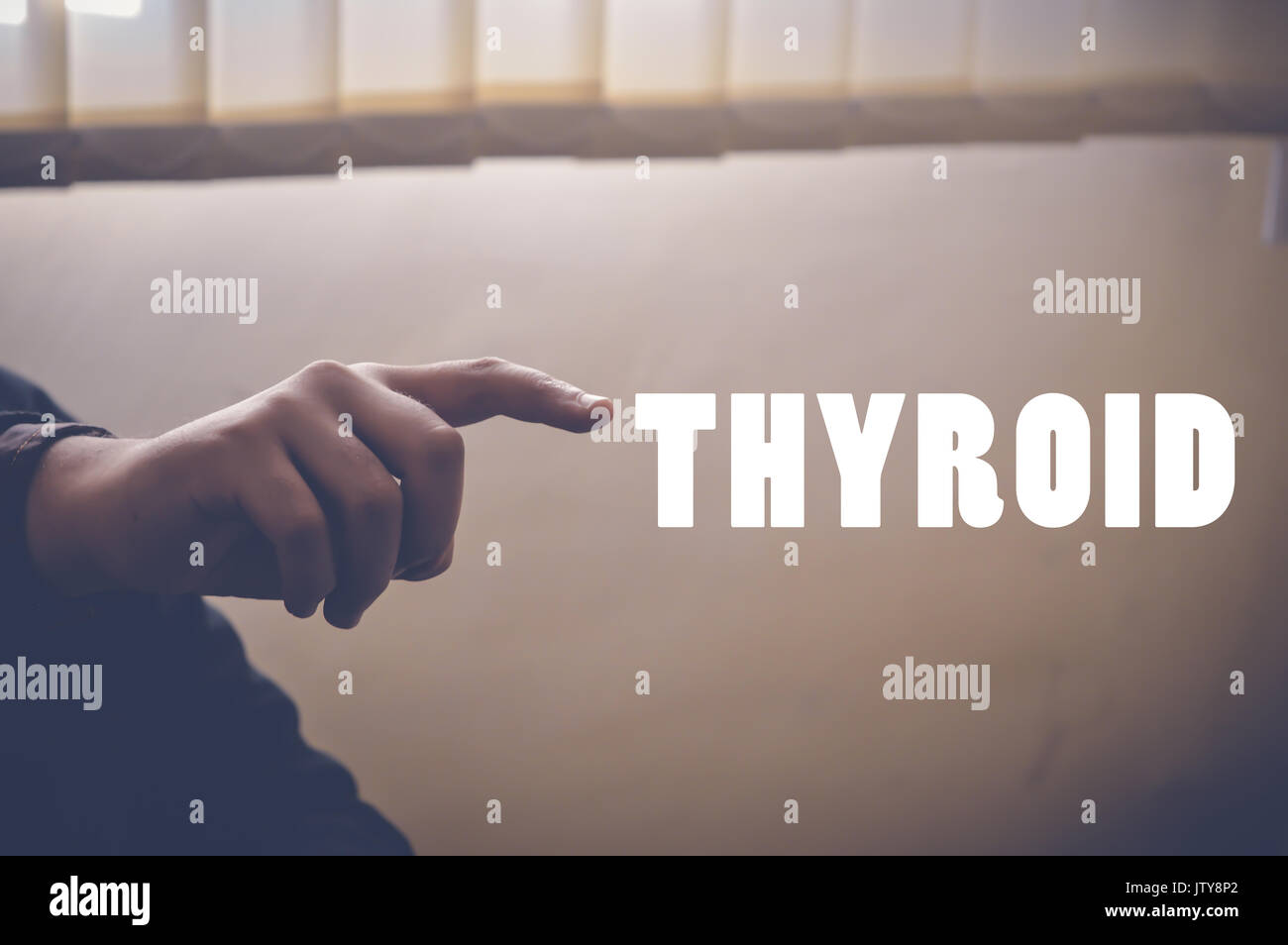 hand pointing to thyroid, health concept background Stock Photo - Alamy