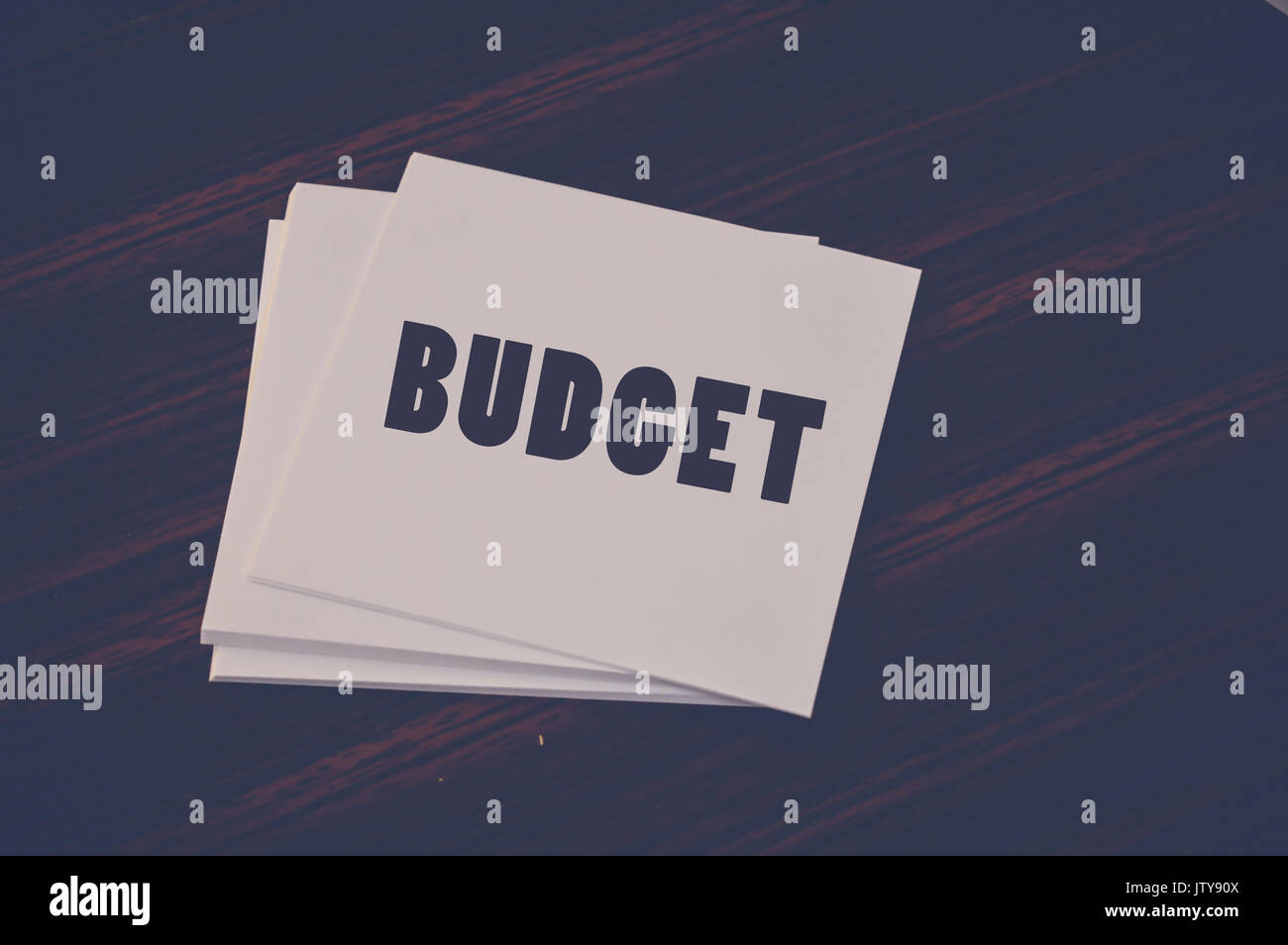 budget written on white notepaper Stock Photo - Alamy