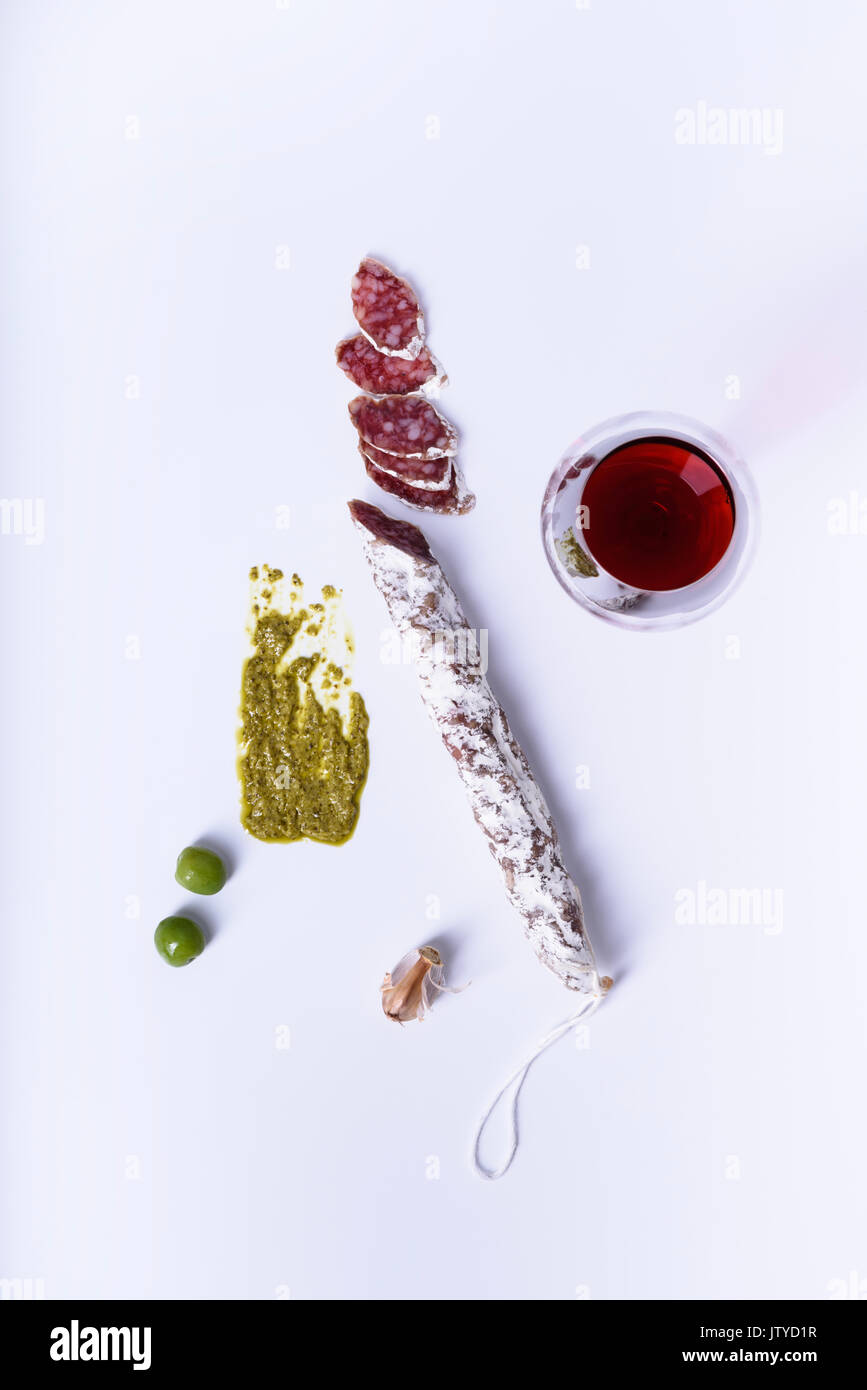 Charcuterie with wine, olives, pesto sauce and garlic. Tapas ...