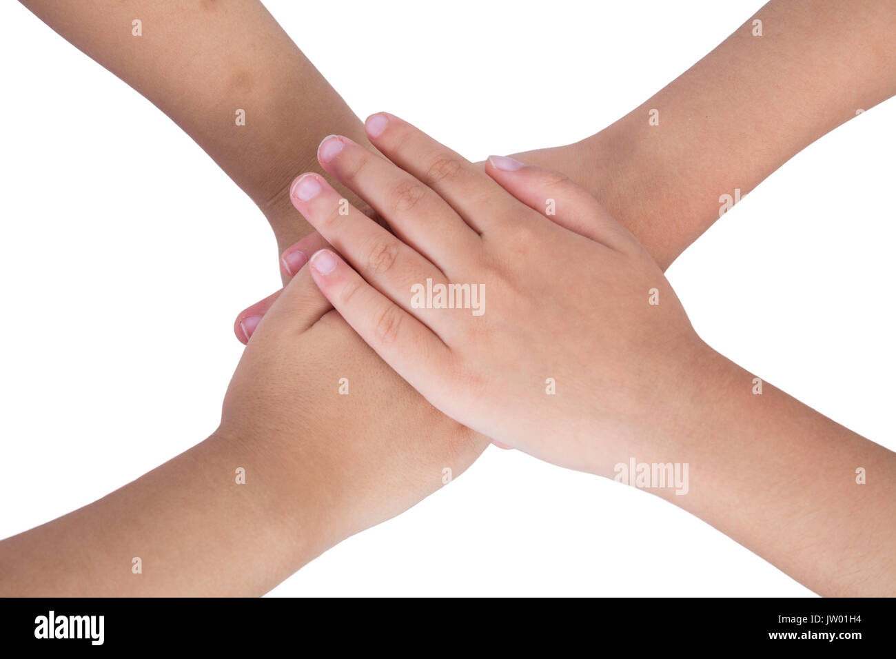 Four child's hands folded on each other in isolated white background ...