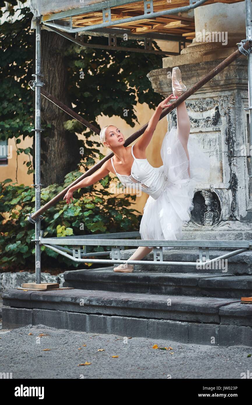 Ballerina dancing near building under construction Stock Photo - Alamy