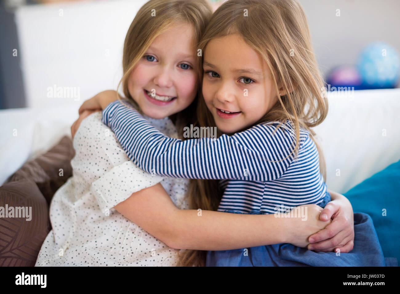 Close up of girls embracing each other Stock Photo - Alamy