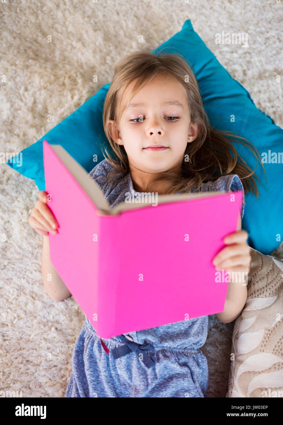 Favorite book can be really absorbing Stock Photo - Alamy