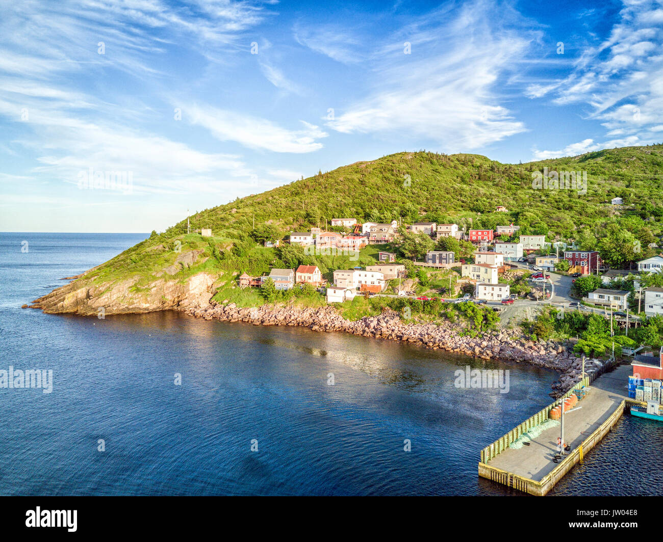 Beutiful Petty Harbour with two piers during summer sunset ...