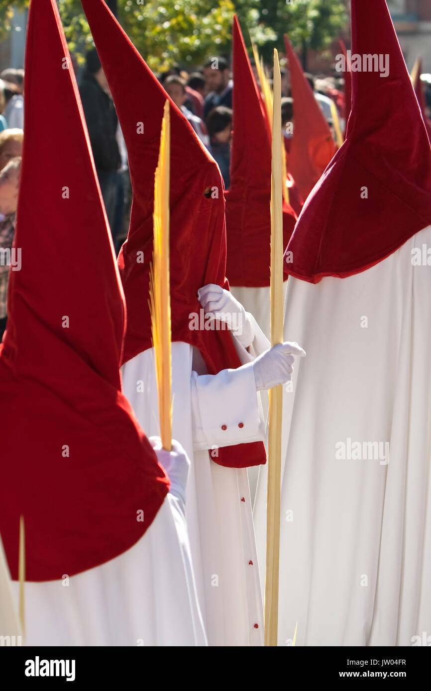 Penitents with caperuz red during station of penance in Holy Week ...