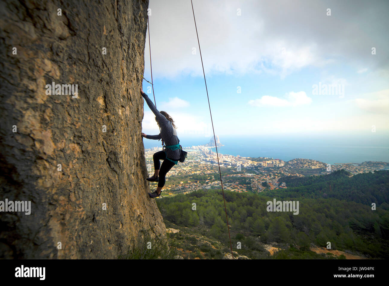 A woman top rope climbing a route at Olta, a climbing area high above ...