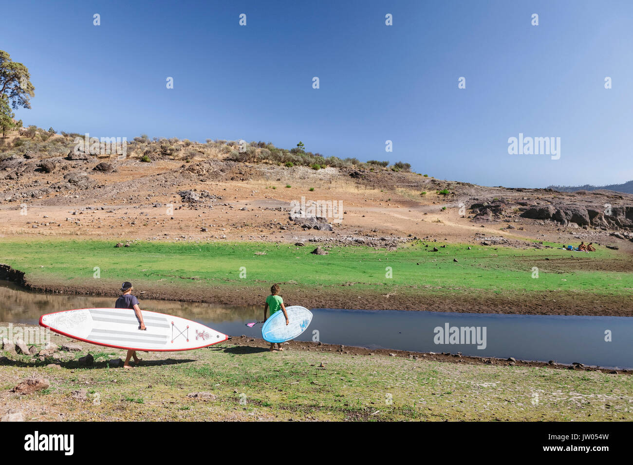 two stand up paddlers enjoying a session of stand up paddle in the ...