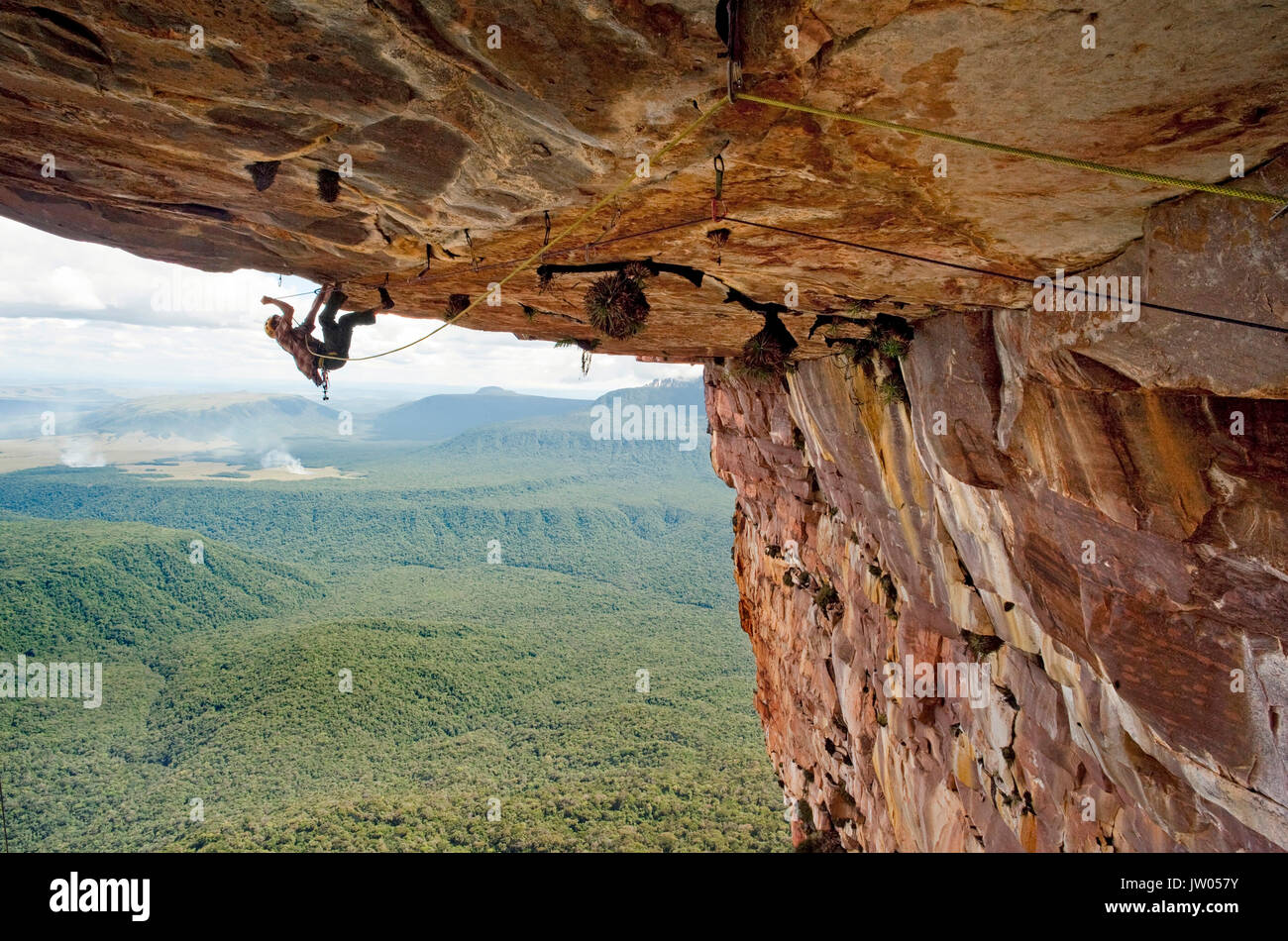 Rock climber hanging from rock ceiling hi-res stock photography and ...