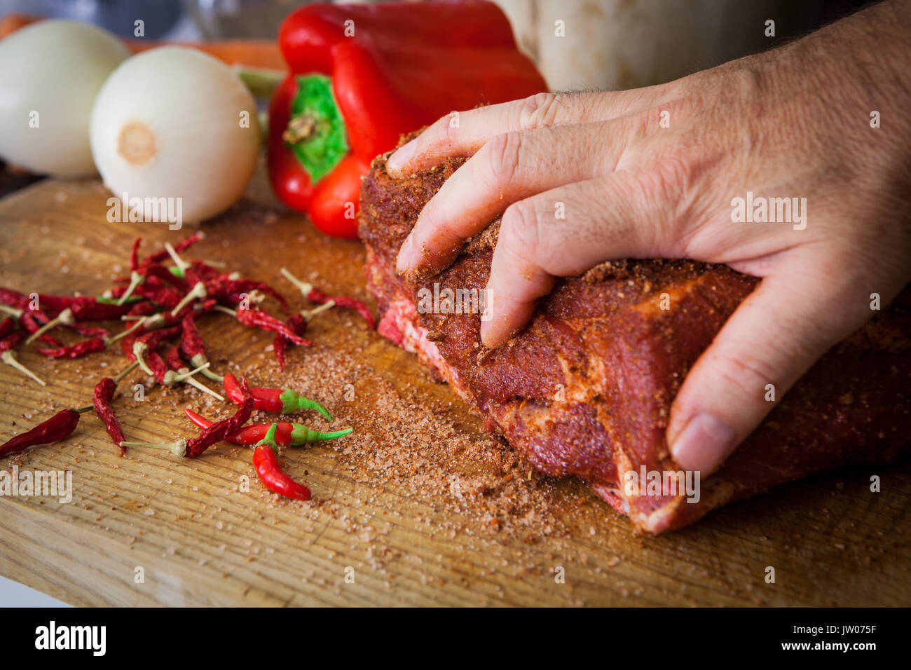 Preparing and seasoning meat for cook pulled pork Stock Photo - Alamy