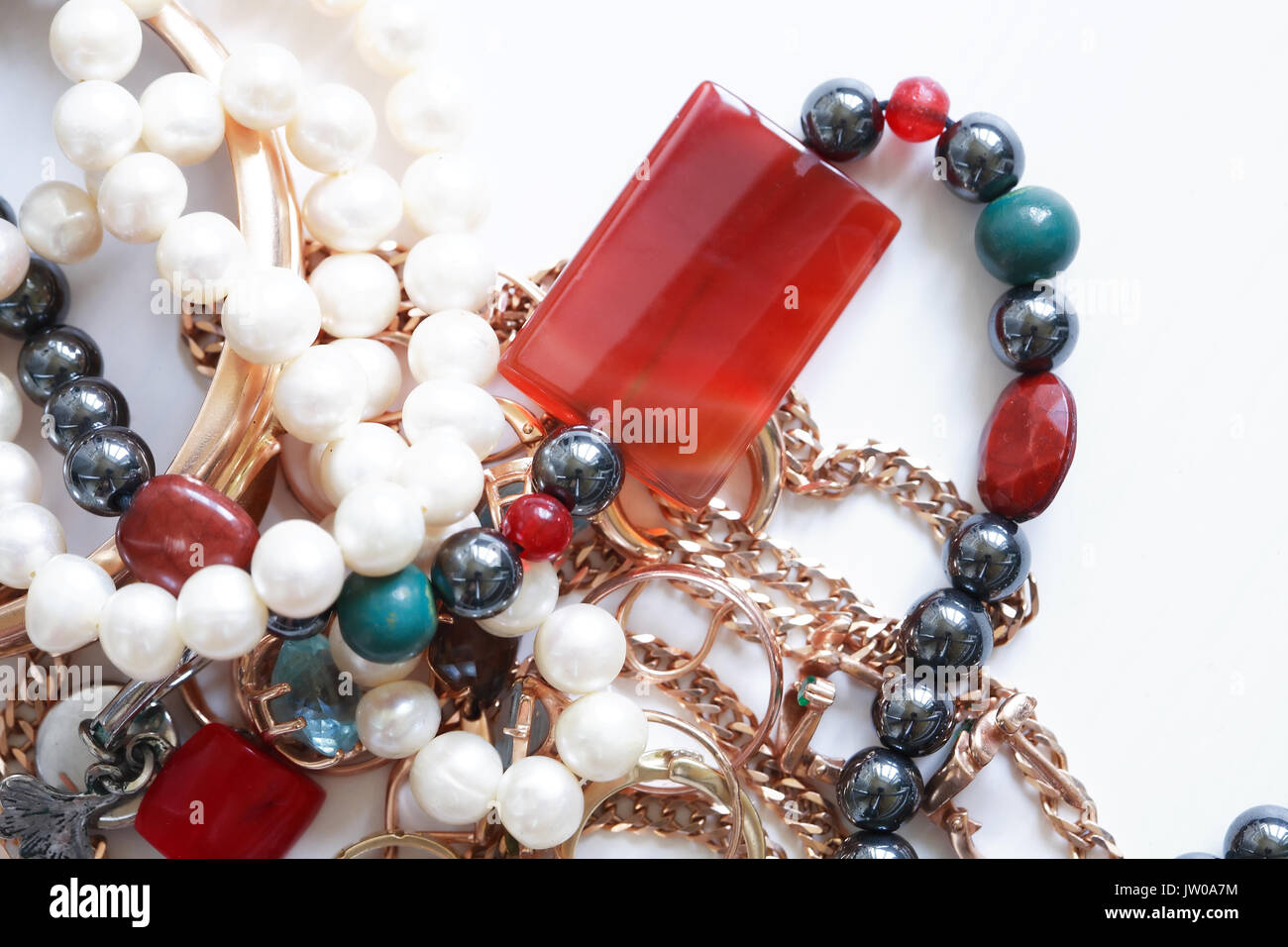Set of various jewelry adornments on white background with free space ...