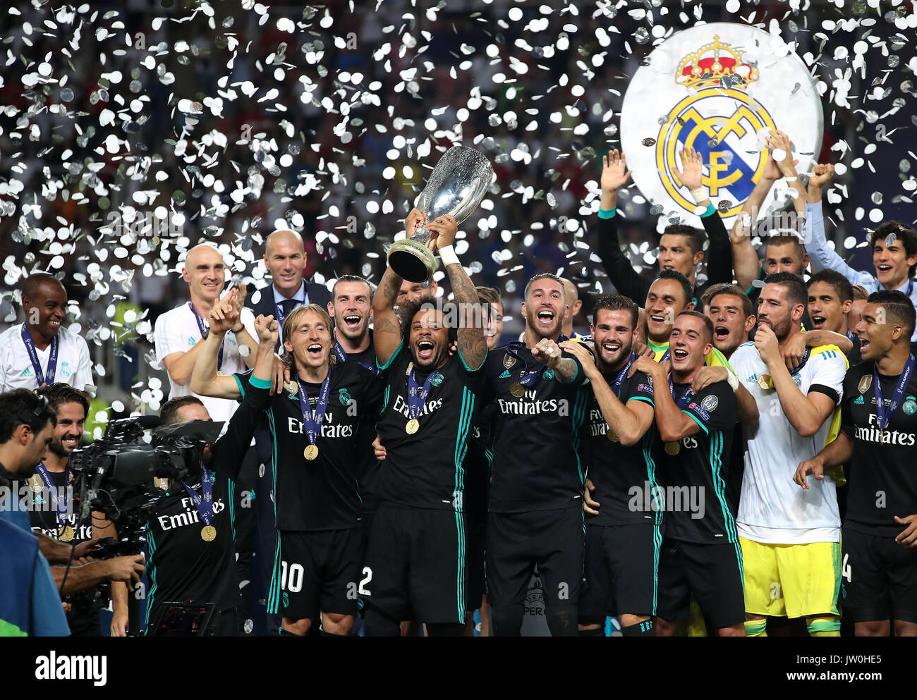 Real Madrid's Marcelo Vieira (centre) lifts the UEFA Super Cup Trophy ...