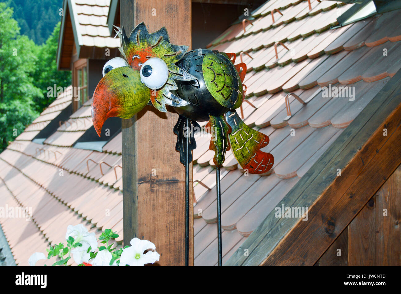 Reproduction of an iron bird with big white eyes in the black forest in ...