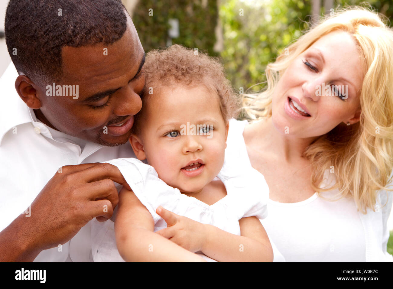 Portrait of happy multicultural family smiling Stock Photo - Alamy