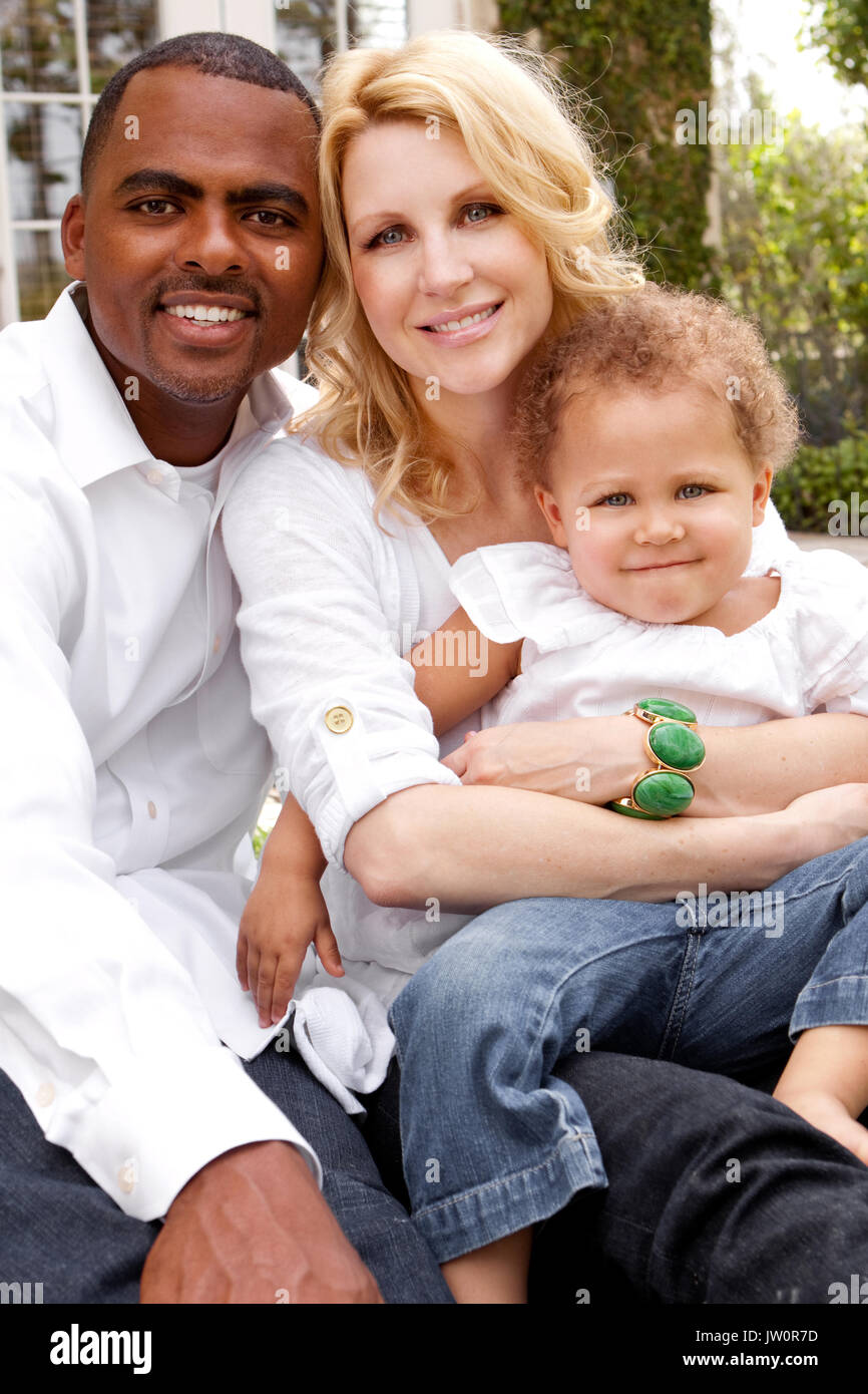 Portrait of happy multicultural family smiling Stock Photo - Alamy