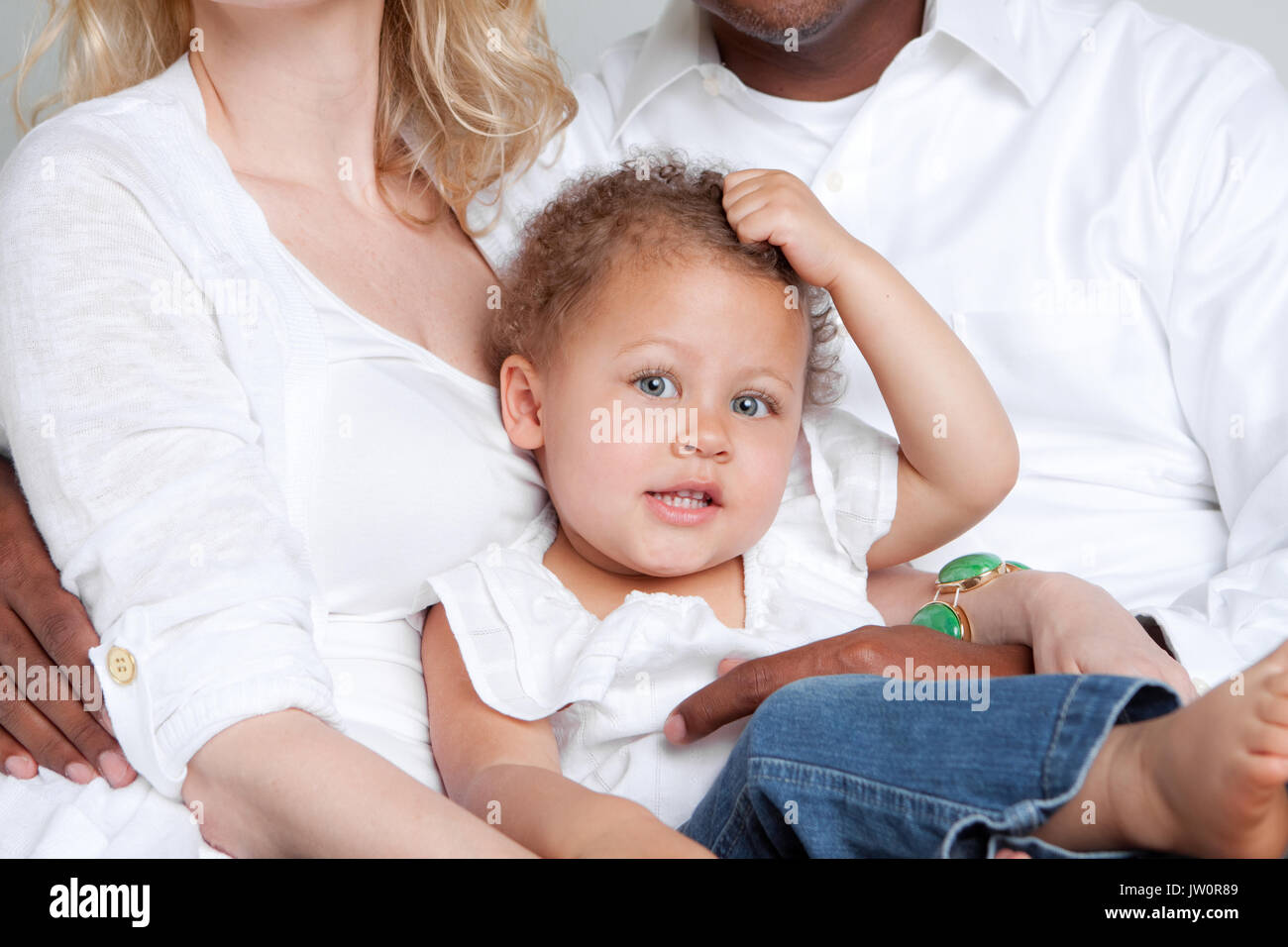 Portrait of happy multicultural family smiling Stock Photo - Alamy