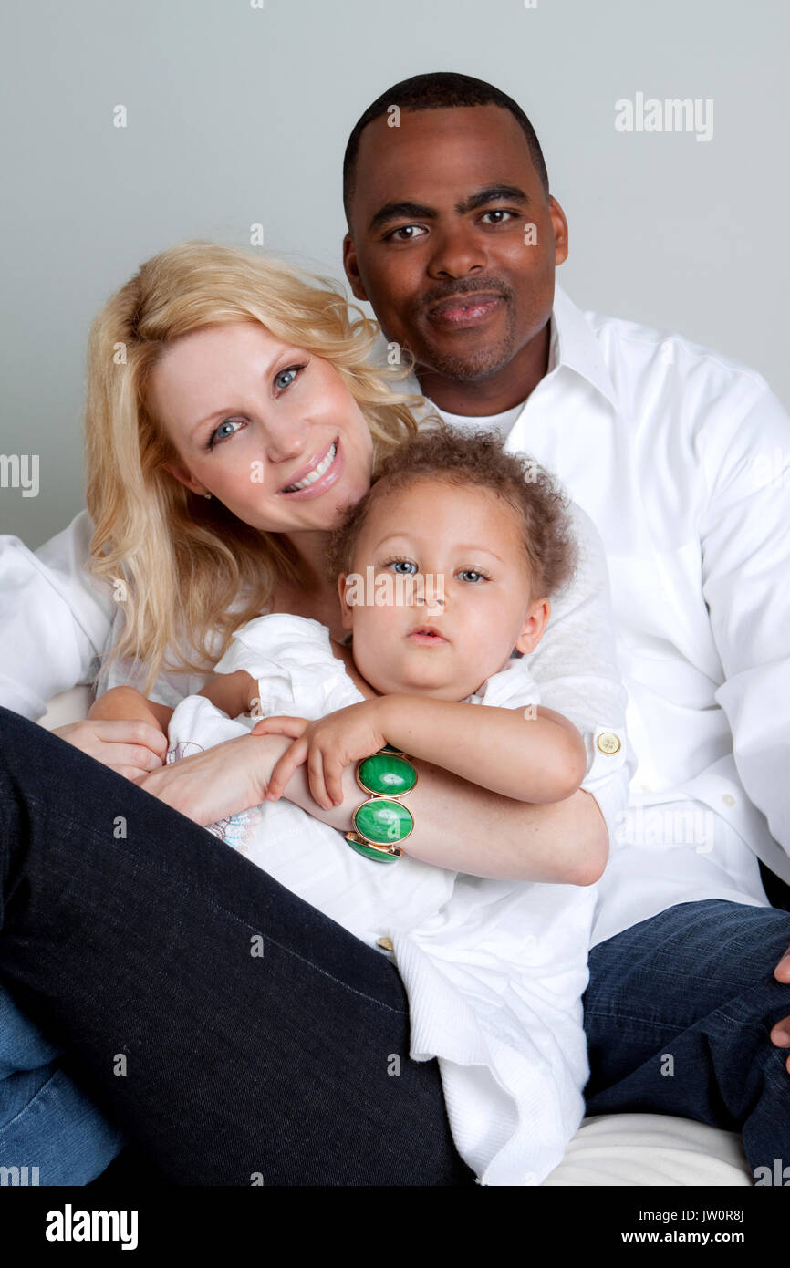Portrait of happy multicultural family smiling Stock Photo - Alamy
