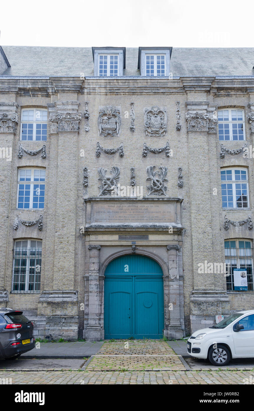 Old blue painted double doors at entrance to building in the French ...