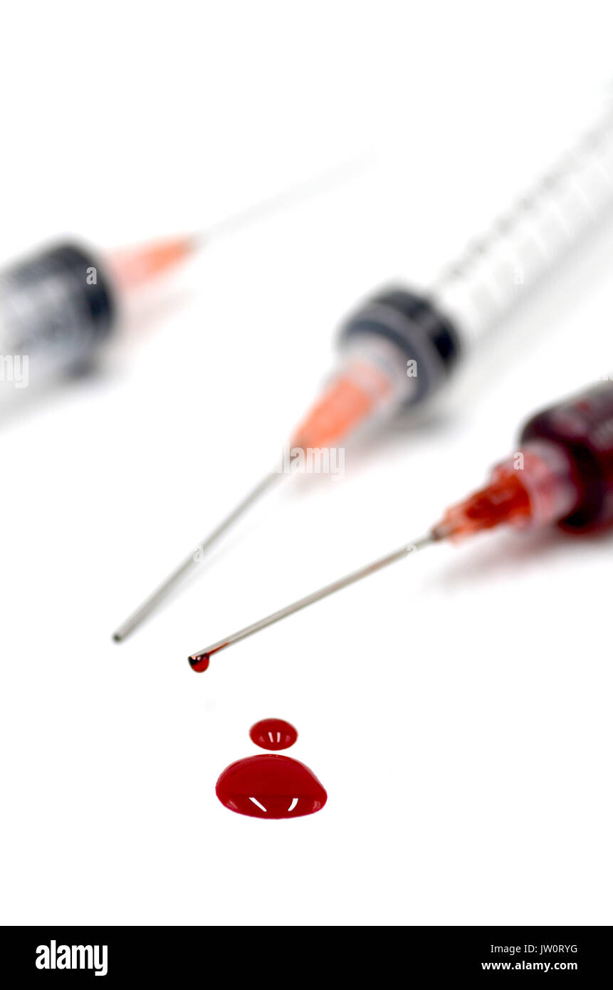 Syringe with blood on white background Stock Photo - Alamy