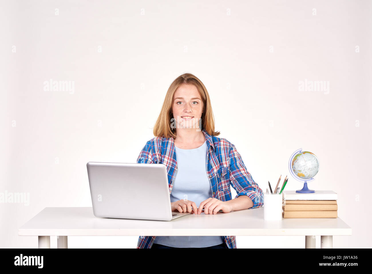 Teenage student at desk Stock Photo - Alamy