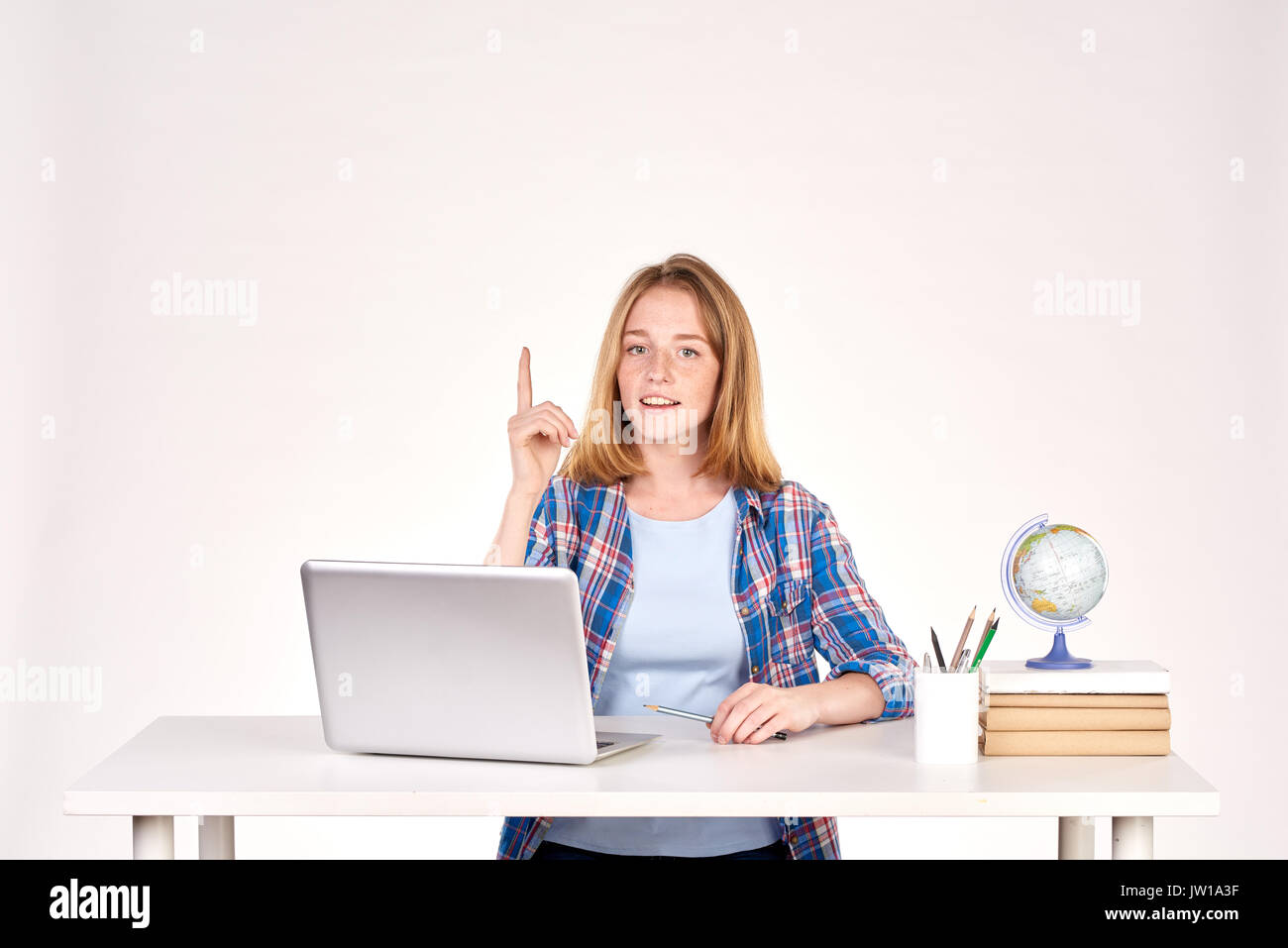 Teenage student at desk Stock Photo - Alamy