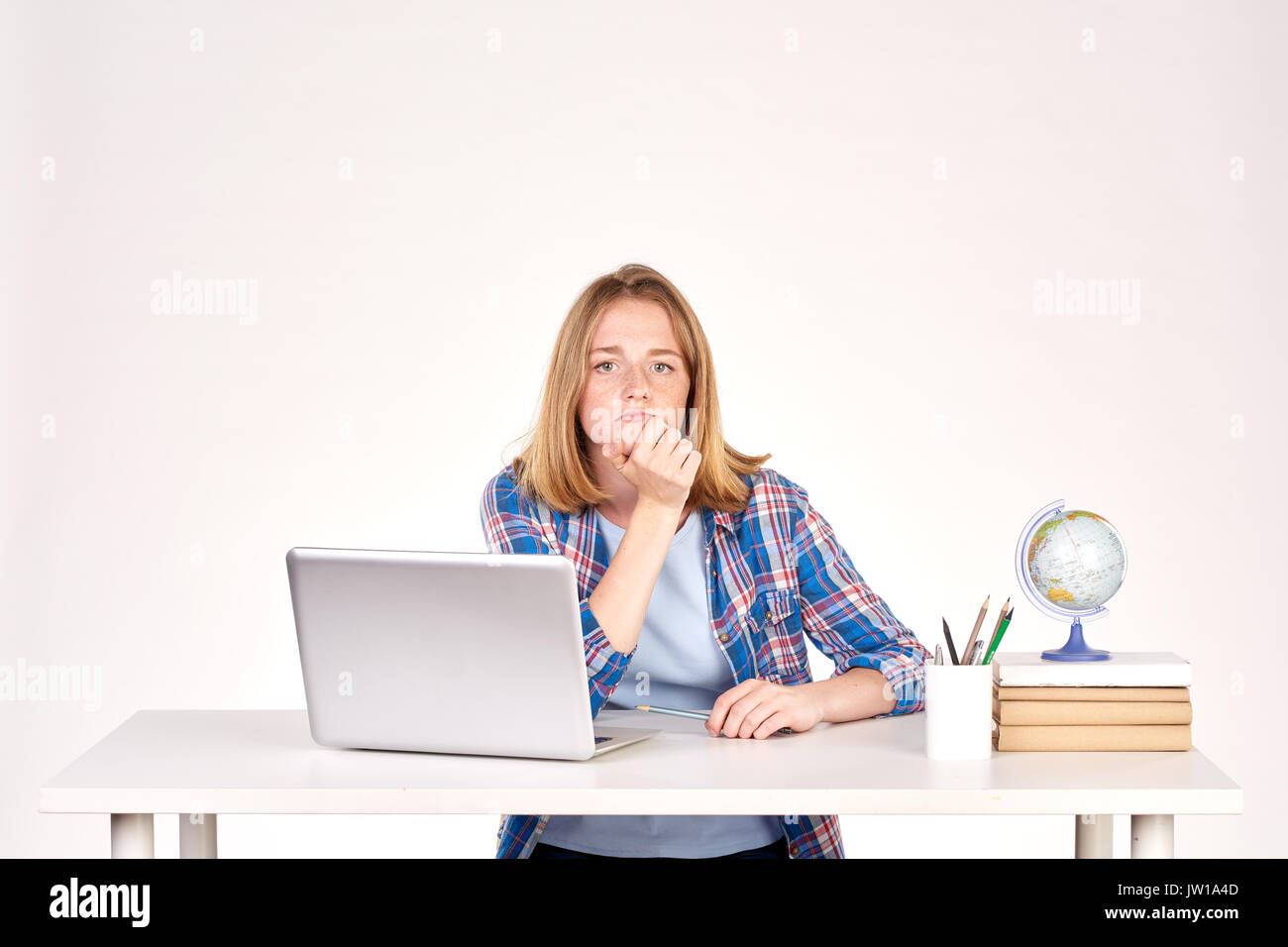 Teenage student at desk Stock Photo - Alamy