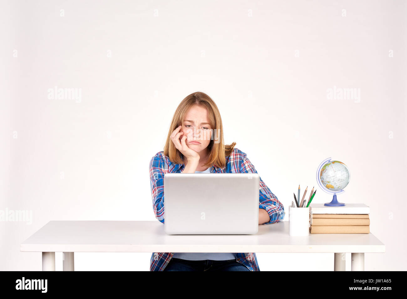 Teenage student at desk Stock Photo - Alamy