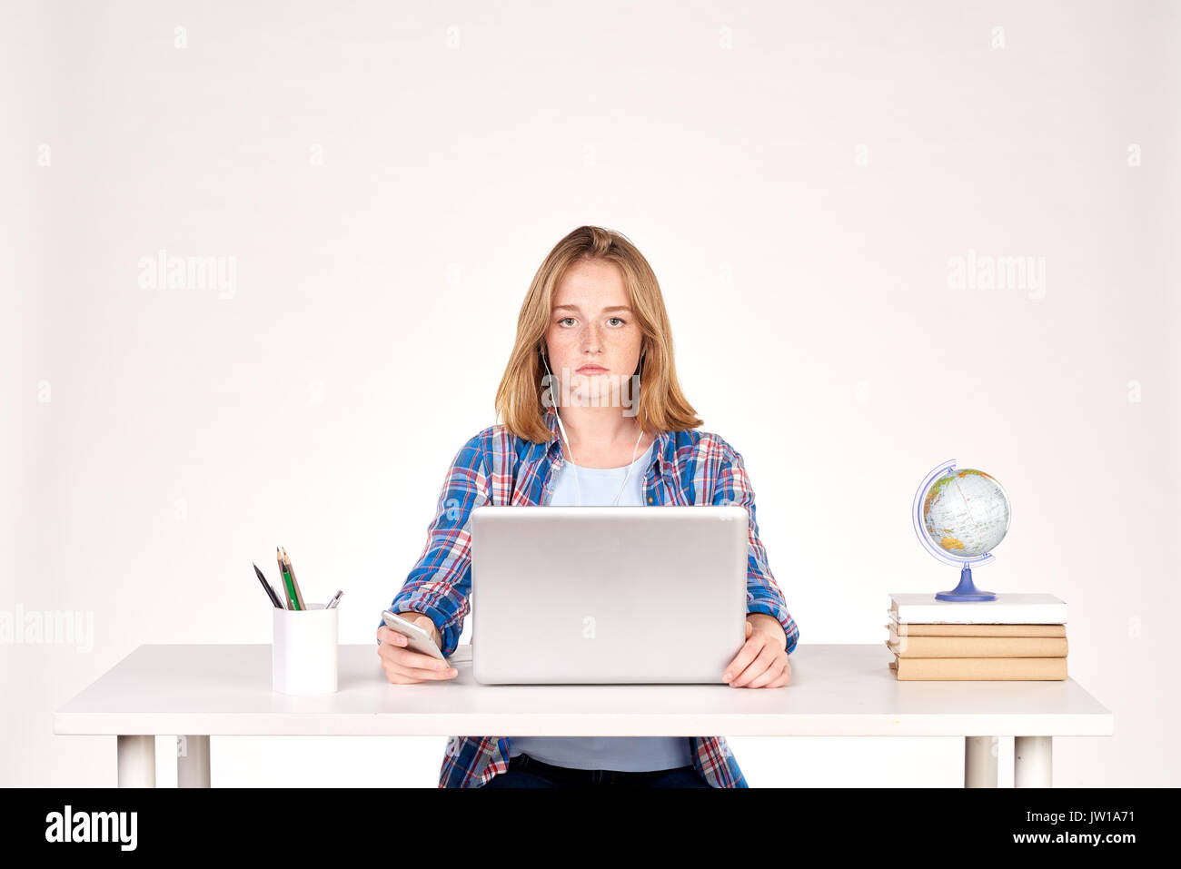 Teenage student at desk Stock Photo - Alamy