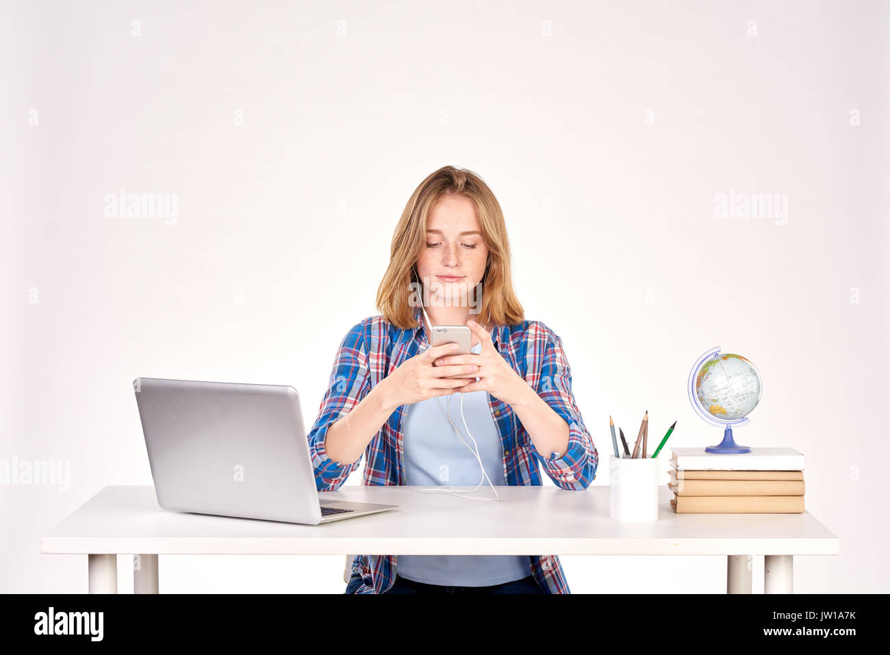 Teenage student at desk Stock Photo - Alamy