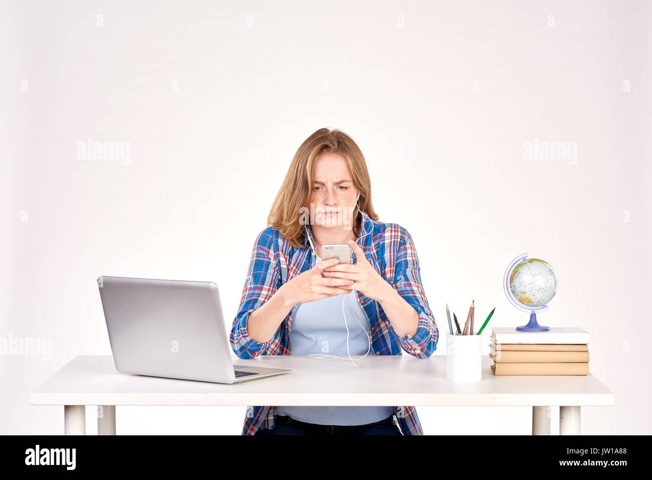 Teenage student at desk Stock Photo - Alamy
