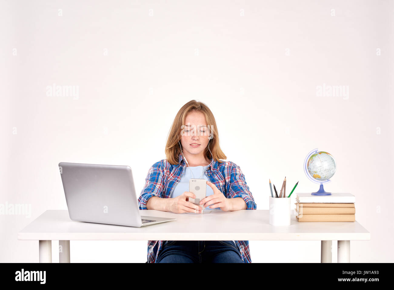 Teenage student at desk Stock Photo - Alamy