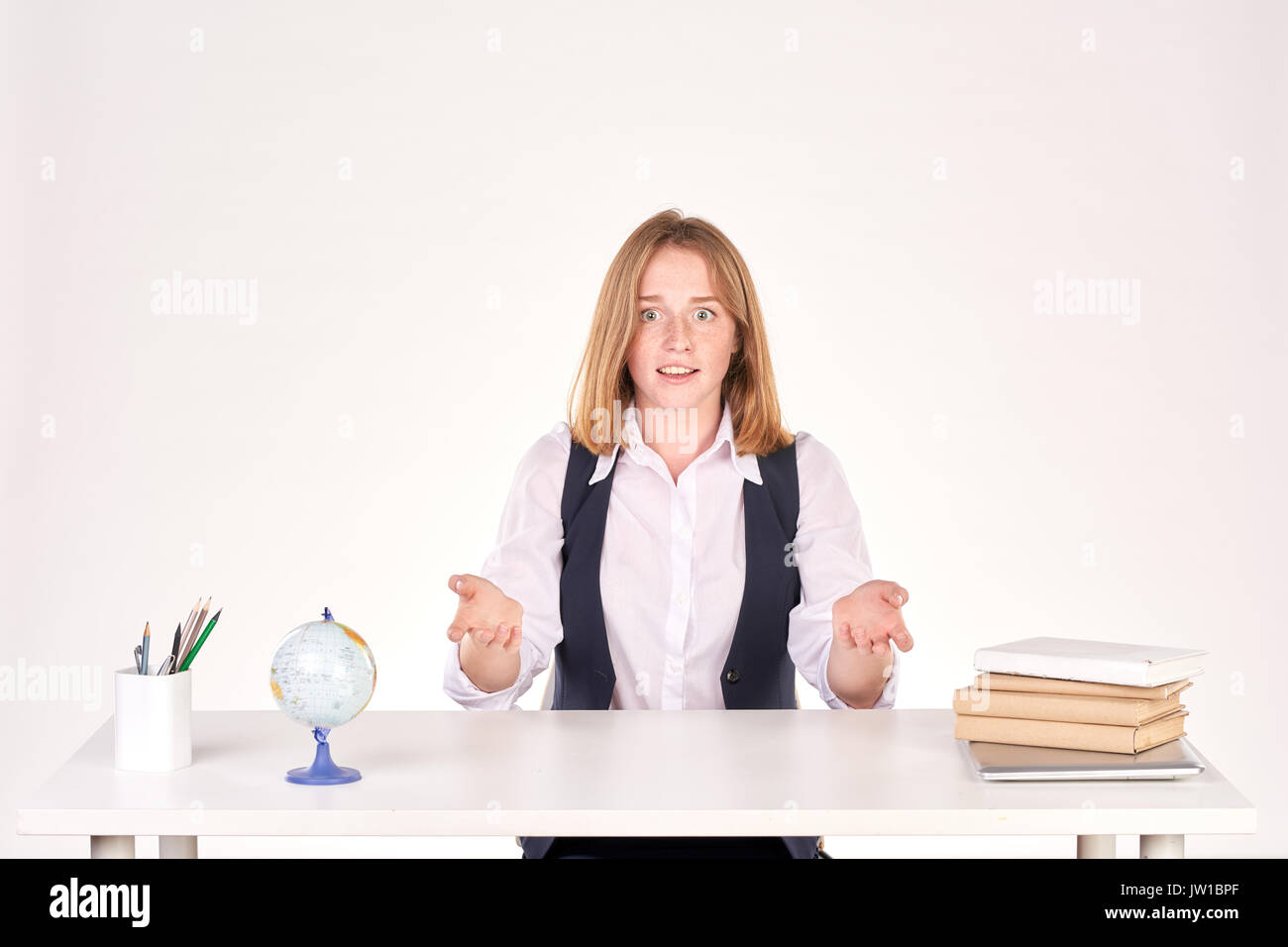 Girl studying at desk Stock Photo - Alamy