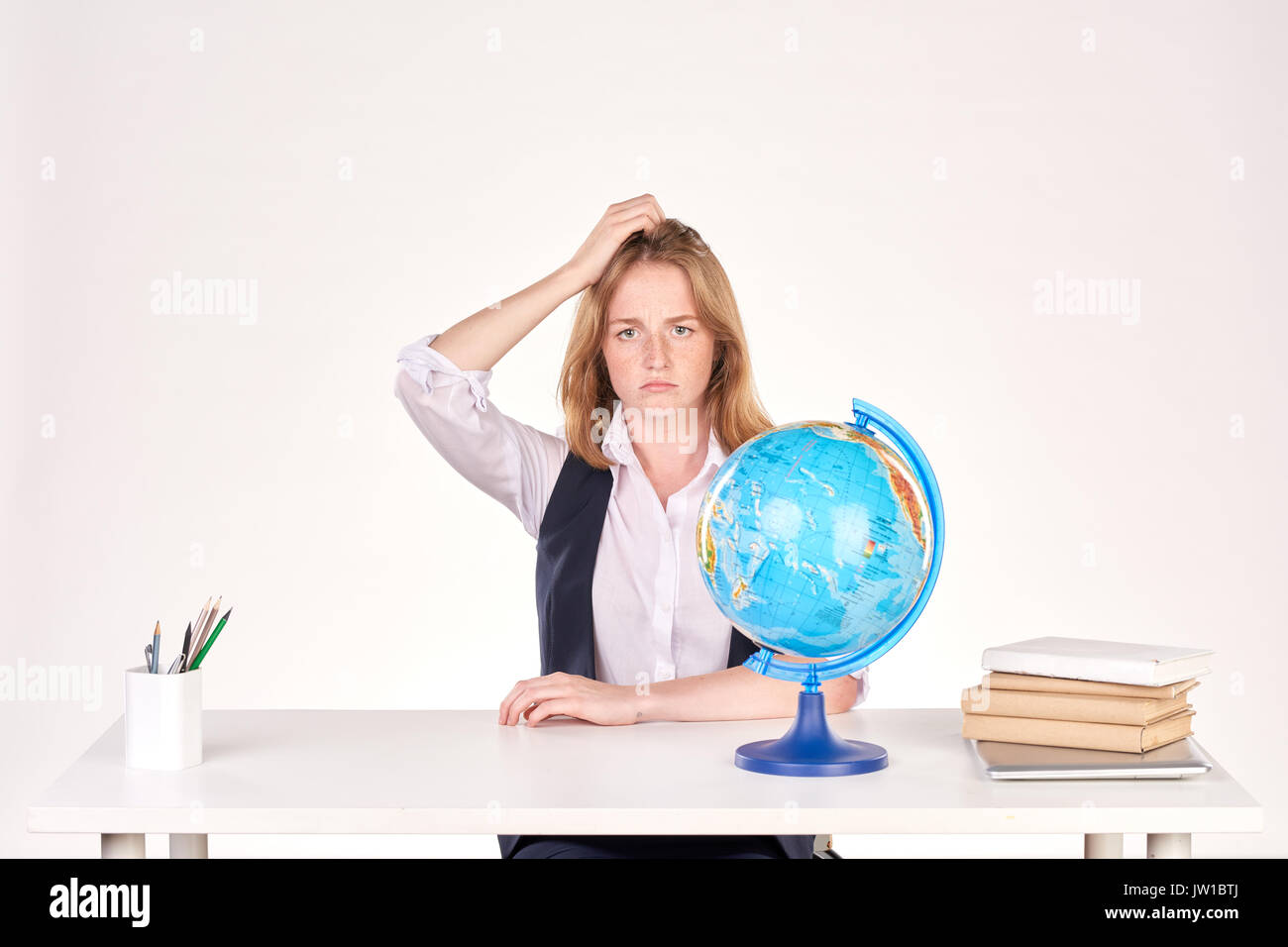 Girl studying at desk Stock Photo - Alamy