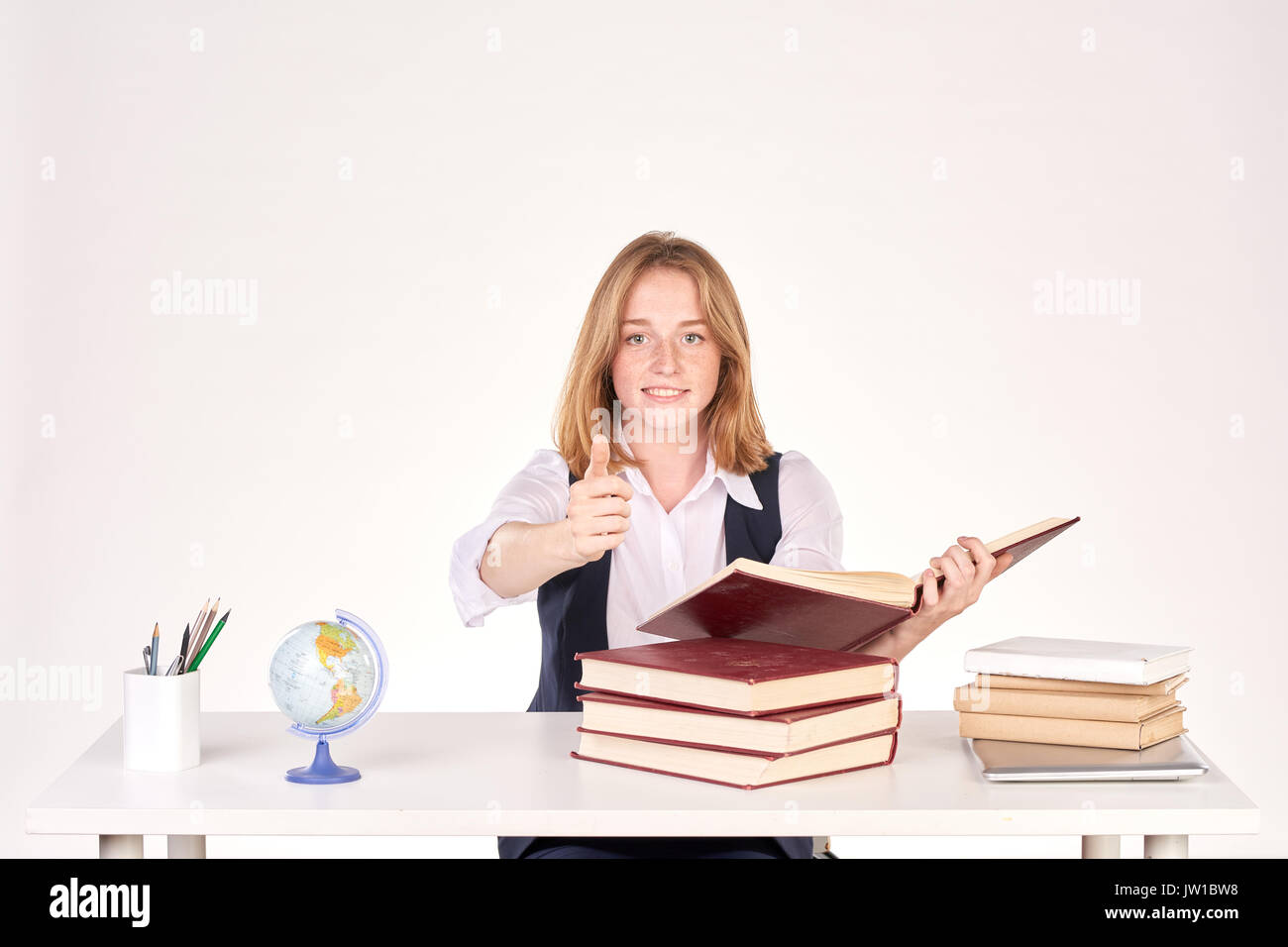 Girl studying at desk Stock Photo - Alamy