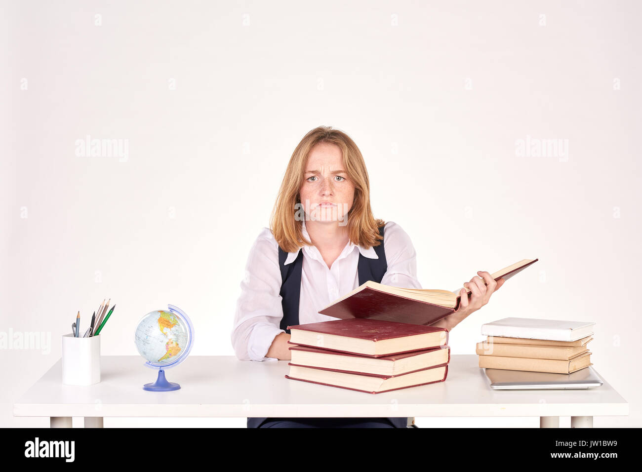 Girl studying at desk Stock Photo - Alamy