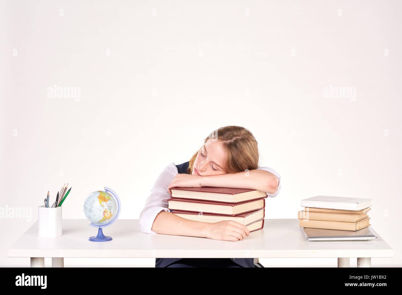 Girl studying at desk Stock Photo - Alamy