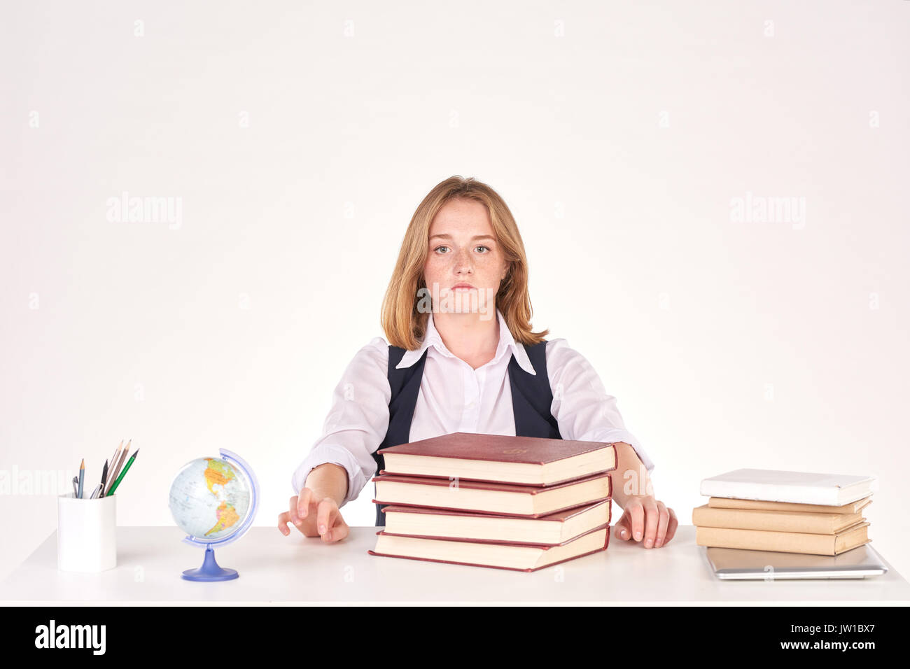 Girl studying at desk Stock Photo - Alamy