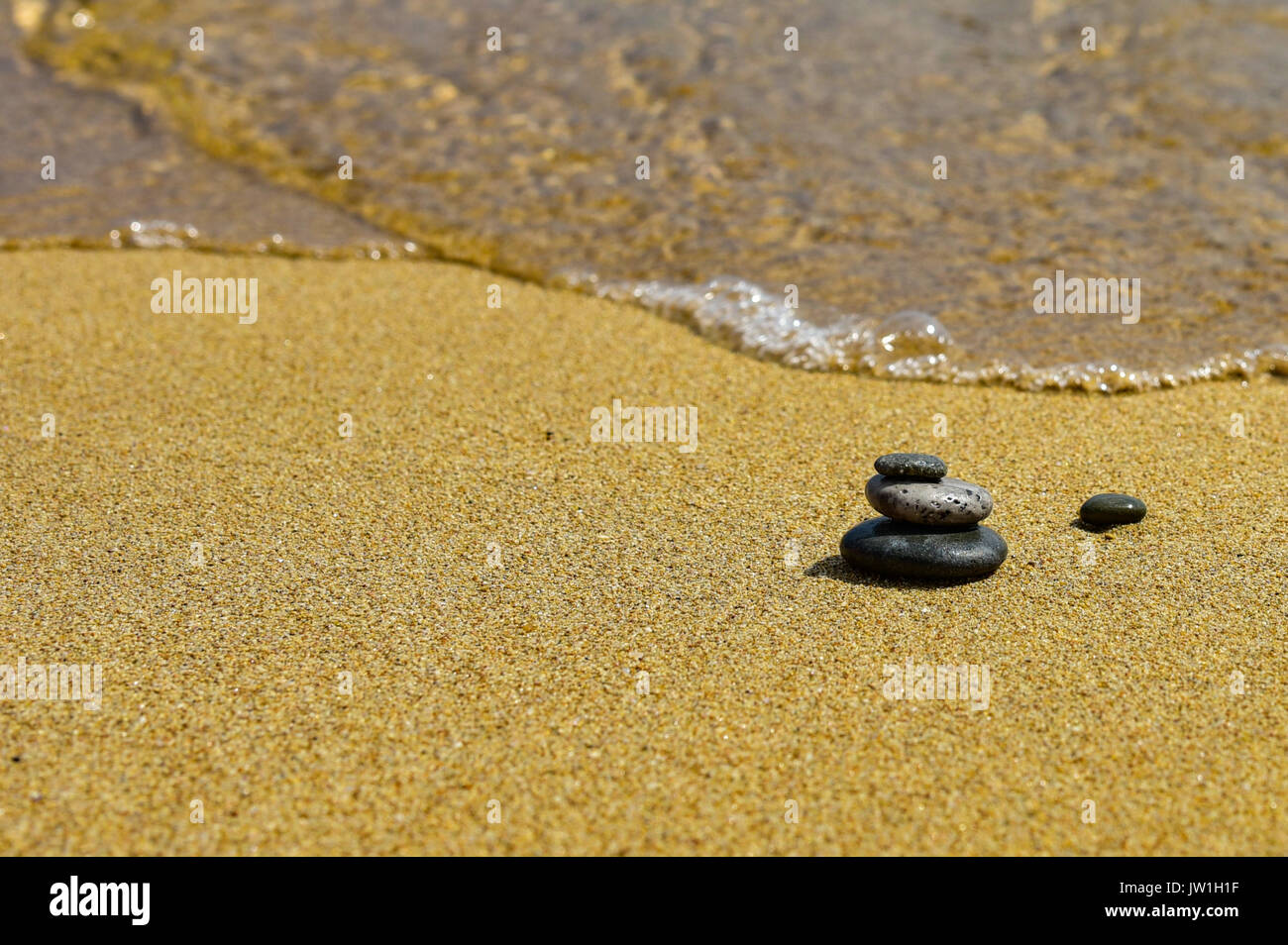 Balance stone on river coast Sand water pebbles relax Stock Photo - Alamy