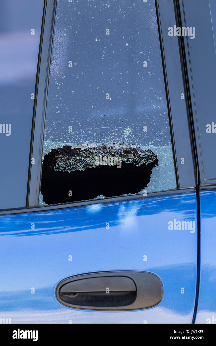 Smashed car door window from vehicle burglary Stock Photo - Alamy