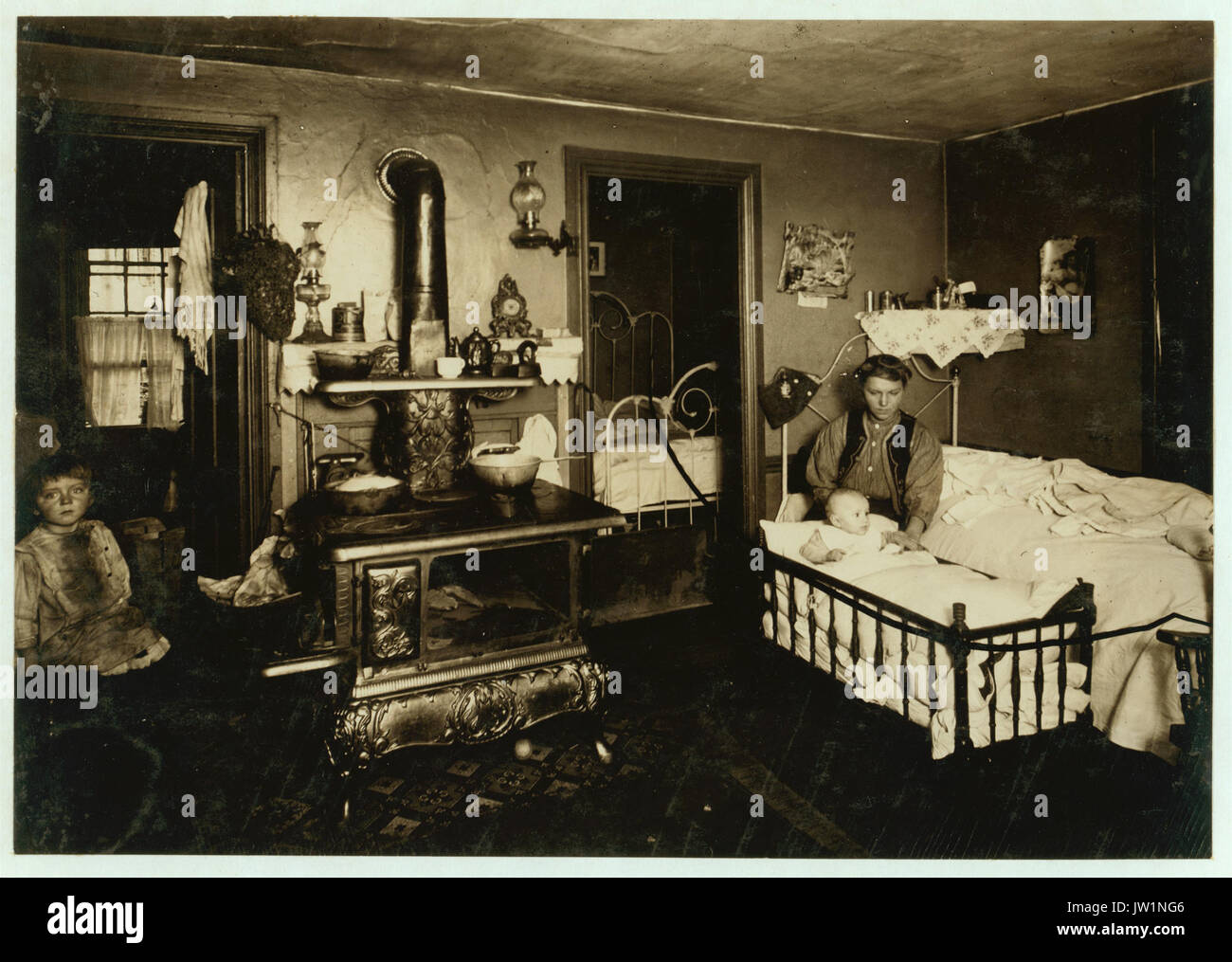 Overcrowded home of workers in cotton mill Stock Photo - Alamy