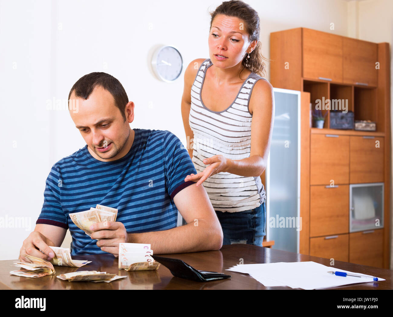 Sad woman husband counting hi-res stock photography and images - Alamy
