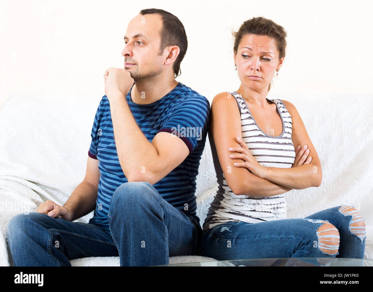 Young sad couple sorting out their relationship Stock Photo - Alamy