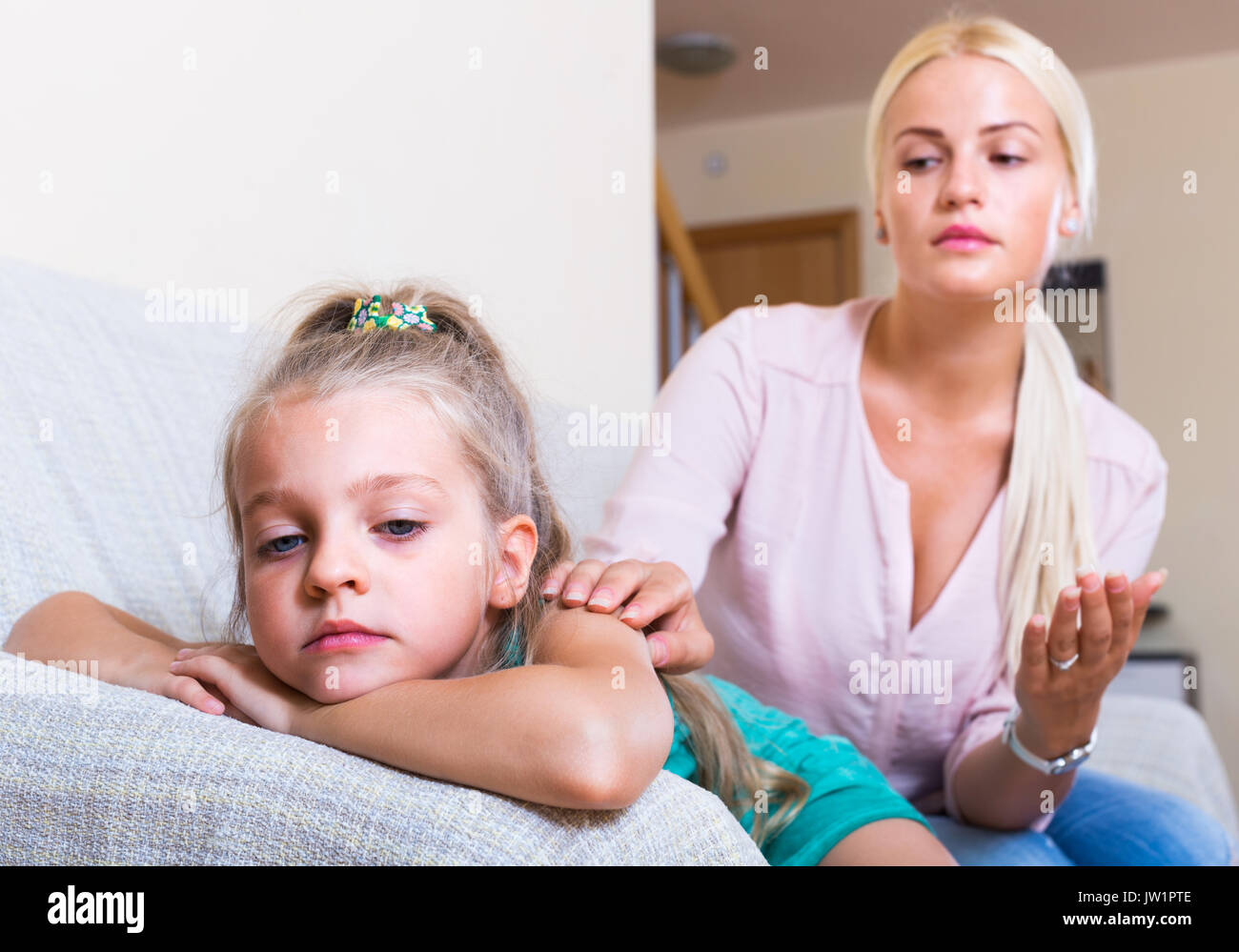 Home portrait of soft character woman and offended child Stock Photo ...
