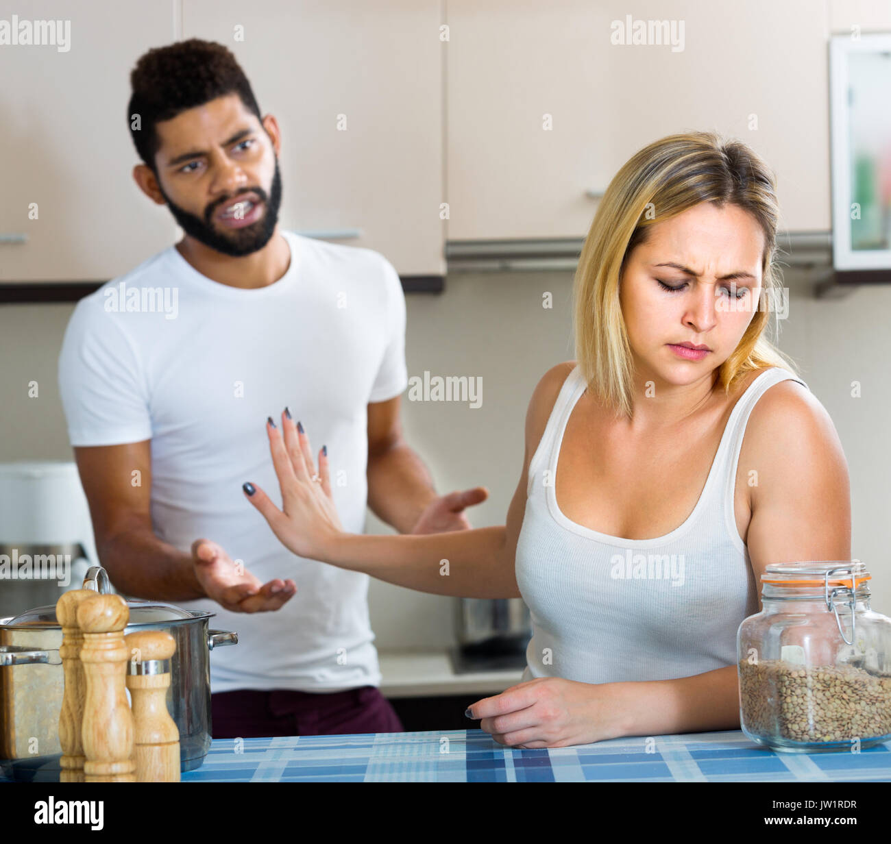 Upset black man and frustrated white housewife having bad argument ...