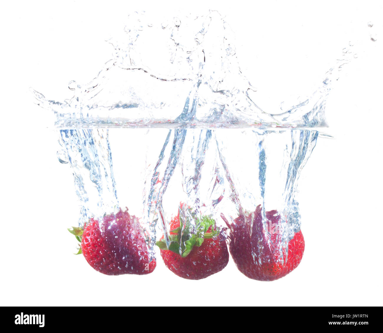 Ripe Strawberries Dropping Into Water Stock Photo - Alamy