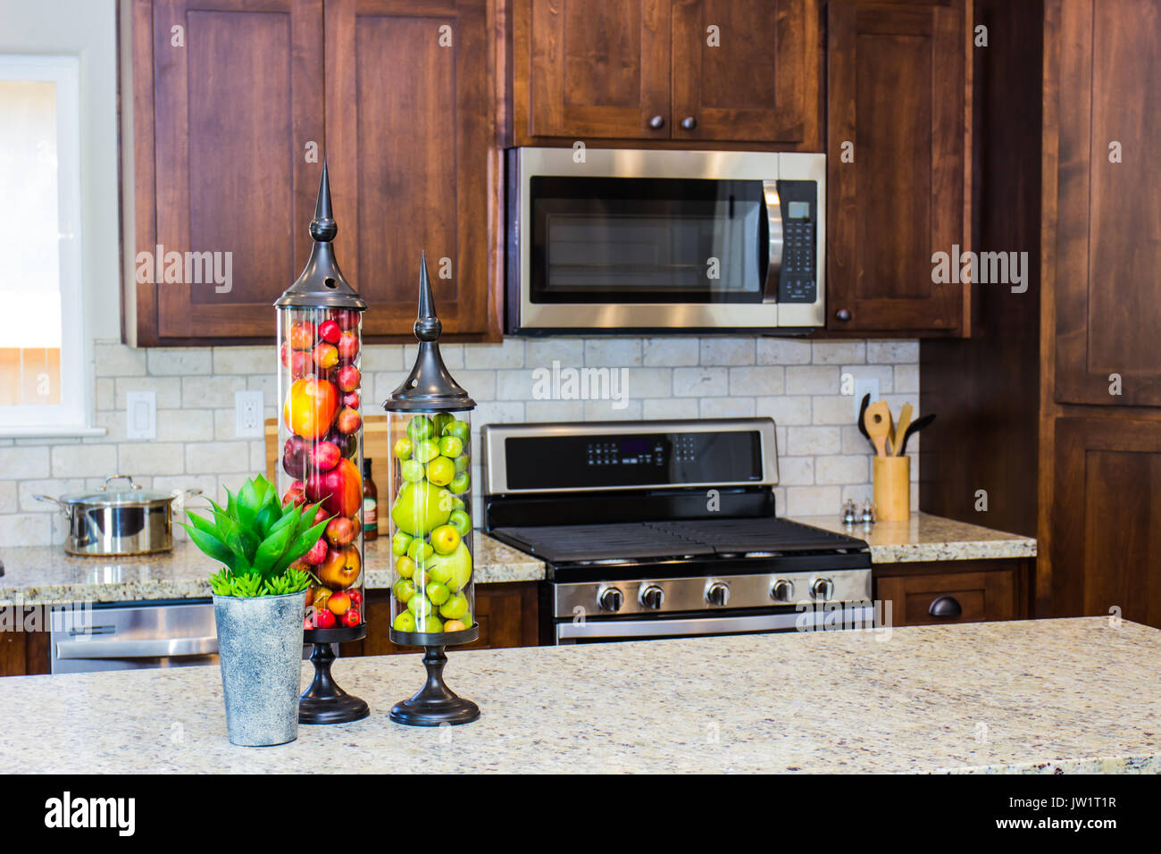 Modern Kitchen With Glass Fruit Containers Stock Photo - Alamy