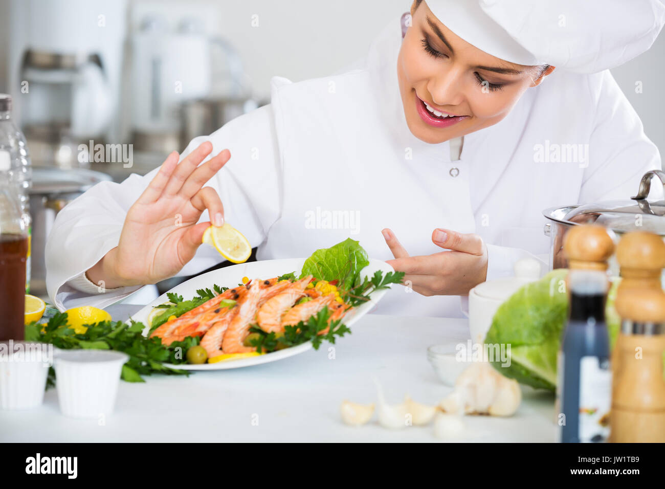 Professional chef decorating salmon hi-res stock photography and images ...
