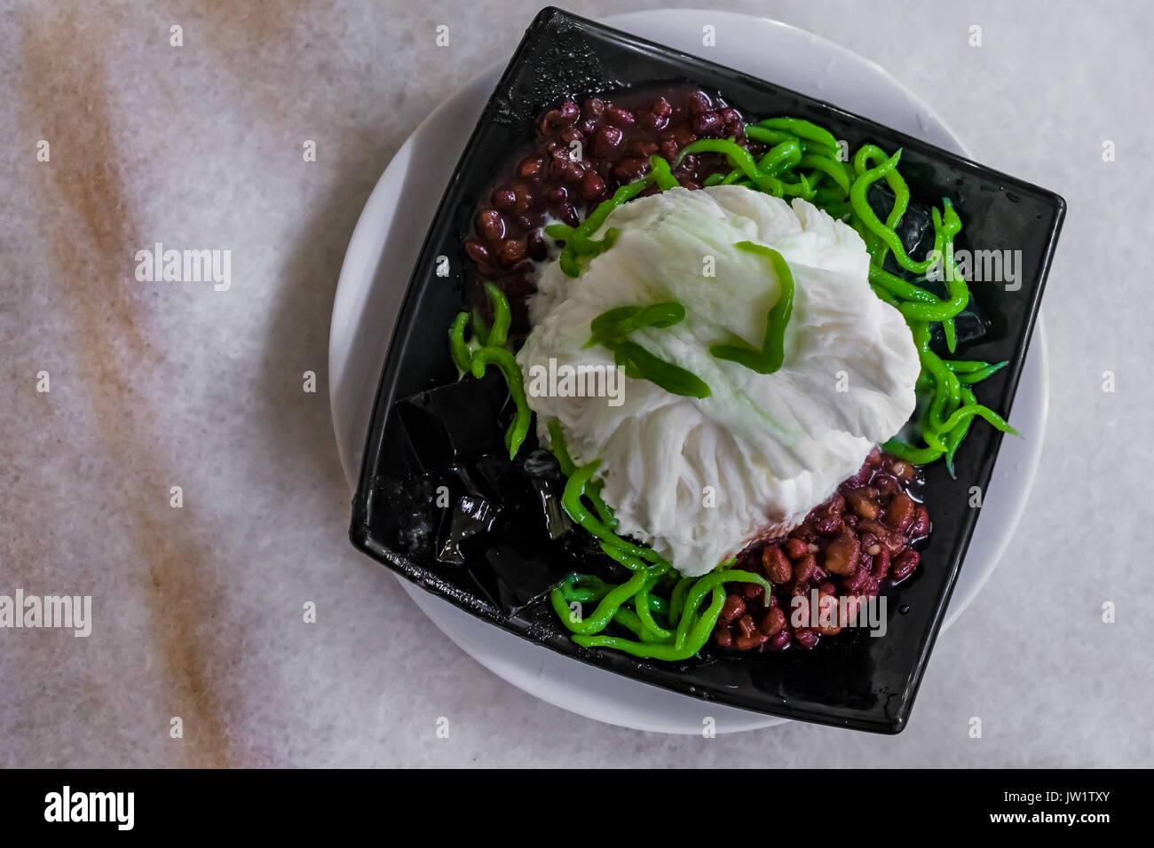 Traditional Singapore cold dessert called Chendol, served with coconut ...